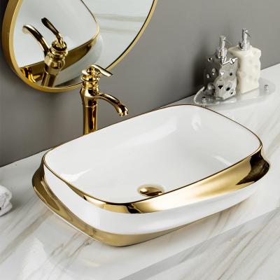 China Luxury Golden Art Ceramic Wash Hand Basin Modern Oval Shaped Stain Resistant for sale