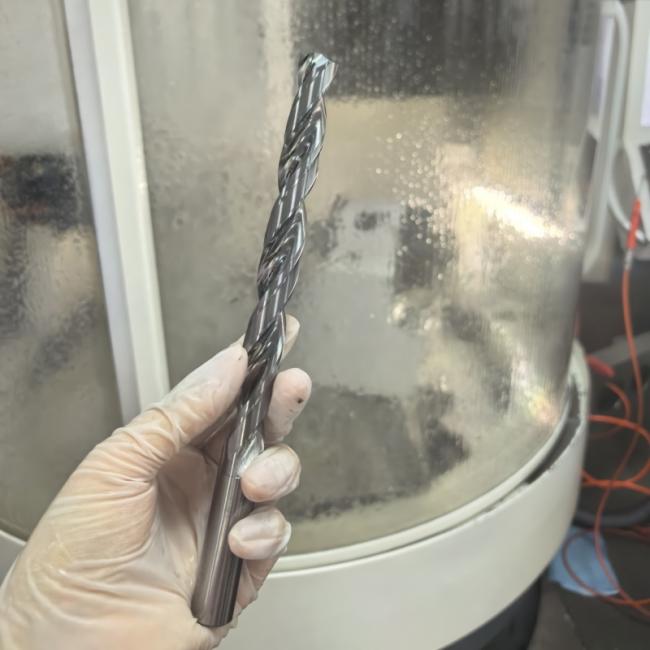 AMG Carbide Twist Drill in operation showing precision drilling