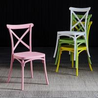 China Hotel Wedding Event PP Pink Plastic Dining Chairs Stackable Customized X Cross Back for sale