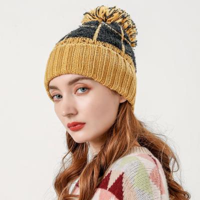 China COMMON Custom Hat Pom Pom Beanie Hats Wholesale Brown Winter Knitted Hat With Pom for sale