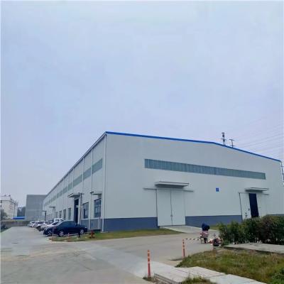 Cina Moderna struttura di acciaio pesante pre-ingegnerizzata edificio magazzino con Q235 acciaio principale e vetro lana isolamento in vendita
