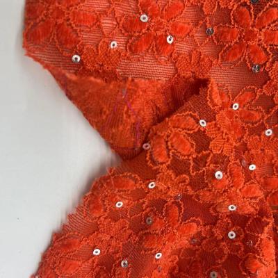 Cina Glitzy Sequins Embroidery Design 100% Polyester Tessuto di colore rosso per stoffa in vendita