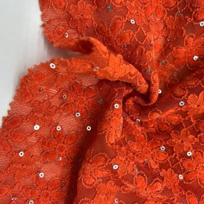 Cina Glitzy Sequins Embroidery Design 100% Polyester Tessuto di colore rosso per stoffa in vendita