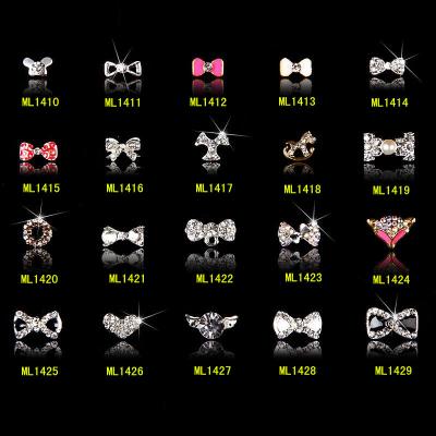 China Bow tie nail glitter rhinestones wheel 3d metal nail art decoration tools ML1410-1429 for sale
