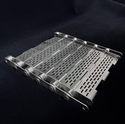 China Keten plaat punch met zijdelingse baffle roestvrij staal transportband voor sorteren for sale