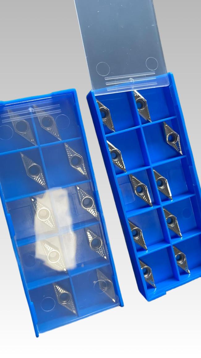 Packaging example showing CCMT09 CNC inserts in plastic boxes