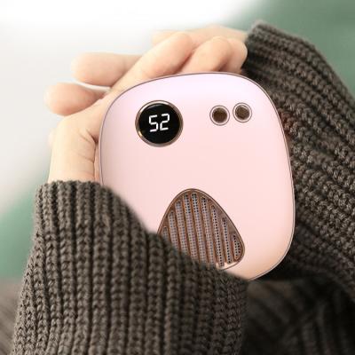 Cina Inverno riscaldatore a mano elettrico USB ricaricabile riscaldamento a doppio lato Mini 5V Pocket Power Bank in vendita