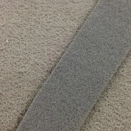 Nonwoven carpet backing