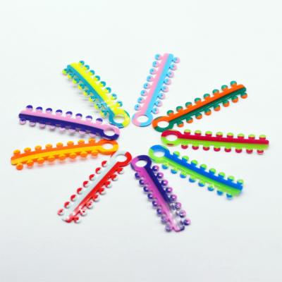 China Dental Products Teeth Orthodontics Elastic Power Chain Orthodontic Ligature ties Double Colors Ligature Tie Wholesale for sale