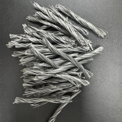 China Formulário Bunchy torcido de rachamento forte 500T dos PP da resistência fibra cinzenta para o assoalho industrial à venda