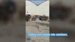Loading used engines into containers.