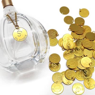 China Custom Luxury Logo Charm Label Hang Tag Etching Embossed Private Gold Metal Branding For Decoration and Perfume Bottle for sale