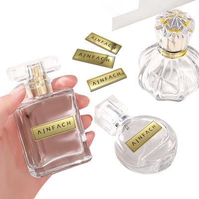 China Customized Aluminum Labels Personalized Self Adhesive Logo Sticker 3d Embossed Gold Finish Metal For Perfume Bottles for sale