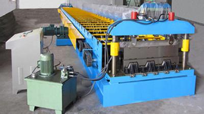 China 0.7-1.5 Thickness Steel Roof Floor Deck Steel Roll Forming Machine For Construction High Speed Production Line for sale