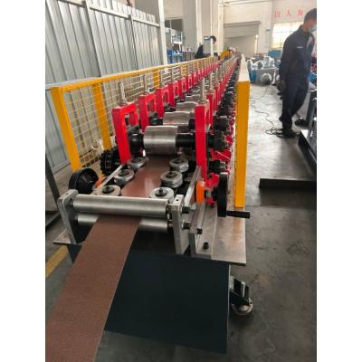 China 0.7-1.2mm Thickness Galvanized Metal Steel Rolling Shutter Door Bottom Slat Roll Forming Machine with Saw Cutting for sale