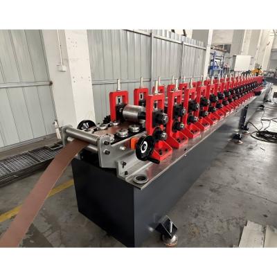 China 0.7-1.2mm Thickness Galvanized Metal Steel Rolling Shutter Door Bottom Slat Roll Forming Machine with Saw Cutting for sale