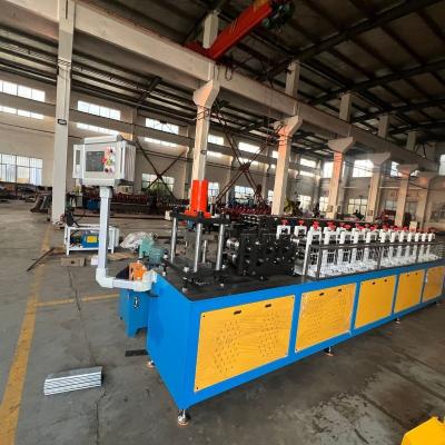 China 75mm 100mm Slat Width Galvanized Metal Industrial Rolling Shutters Roll Forming Machine With Ribs for sale