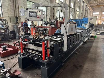 China 0.3-0.7mm PPGI Roller Punching Snap Lock Roof Panel Roll Forming Machine for sale