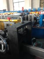 China Fly Saw Cutting Cooling System Rectangle Pipe Downspout Roll Forming Machine with 12-15m/min Speed and 180mm Roller Diameter for sale