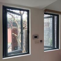 China Durable Aluminum Frame Retractable Screen Window with Fiberglass Screen for sale