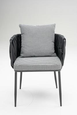 China Custom Luxury Dining Chair with Houndstooth Upholstery Pleated Armrests and Matte Black Metal Frame for sale