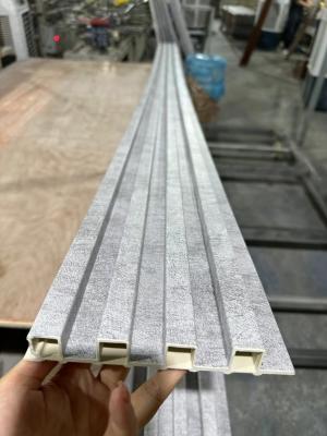 Cina low cost WPC wall panel for interior decorative laminated pvc panels for background grille design in vendita