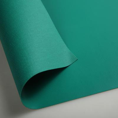 China 600gsm 0.47mm Durable Strong Poly Vinyl Coated Plain Woven Polyester Fabric PVC Tarpaulin for sale