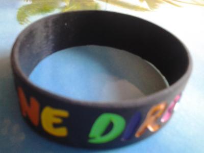 China 25mm fashion debossed silicone wristband with filling color for sale
