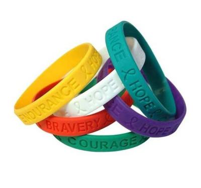 China custom design silicone wristbands with logo debossed for sale