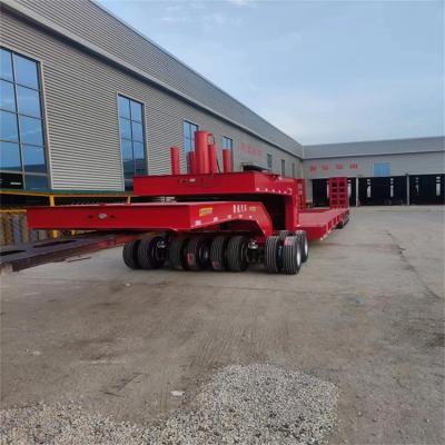 China 60T Max Payload Steel Container Chassis Loader Lowbed Truck Low Platform Semi-Trailer for sale