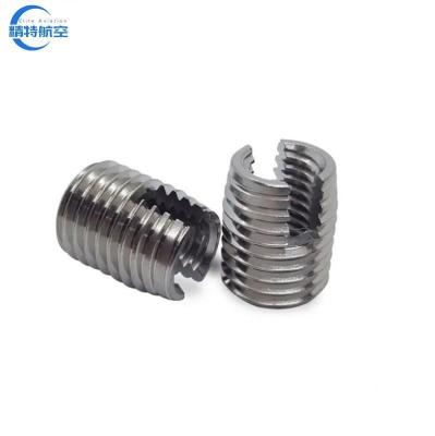 China Other Name Tanged Thread Inserts Unc/Unf Threaded Inserts with Cutting Slot Brass Wire Sleeves Screw Nut for sale