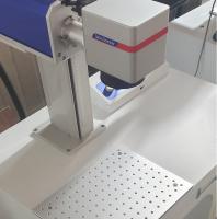 China Portable PET Bottle Laser Marking Machine 0.01mm Accuracy Fiber Laser Engraver for sale
