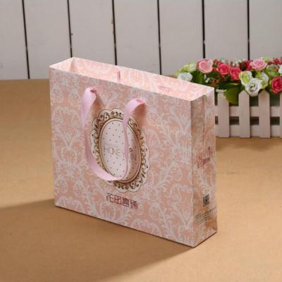 China matt laminated wedding gift paper bags with ribbon handles custom printing available for sale