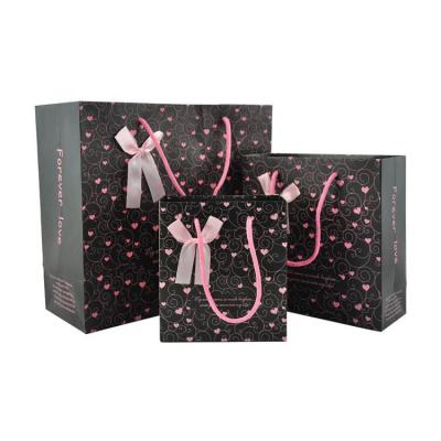 China high grade gift paper bags with ribbon decoration economical custom printed shopping bag for sale