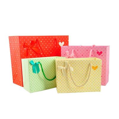 China eco-friendly ivory board material present bags custom color printing gift paper bags for sale