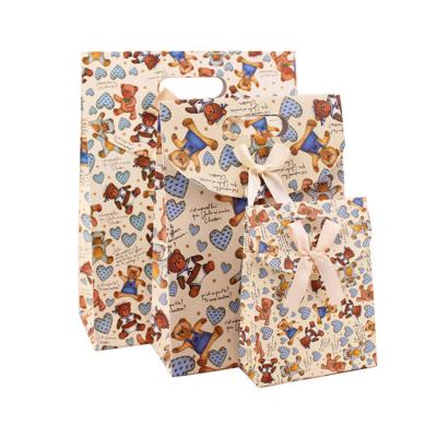 China personalized full color printing folding top design beverage paper packing bags with die cut handle for sale