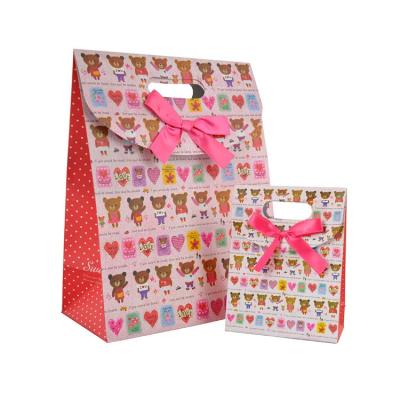 China cute design kids paper candy packaging with die cut handle custom printed paper present bag for sale