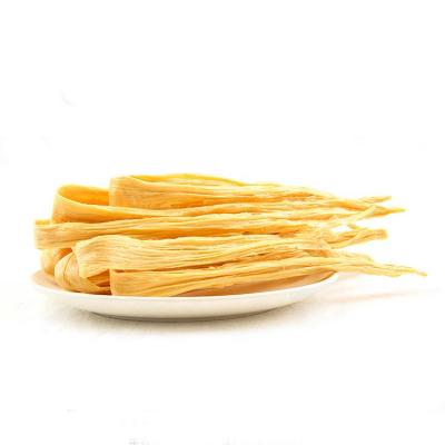 Cina Giallo brillante Yuba Tofu secco Proteine della pelle Fibra Alimenti vegetariani Immersione in acqua 30 minuti Pre cottura in vendita