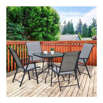 China Foldable Armchair Patio Furniture 4 Seater Dining Set with Glass Top and Umbrella Hole for sale