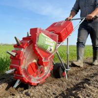 China Manual Seeder Hand Push Planter Adjustable Depth 14-56cm Plant Spacing Multi Seed for sale