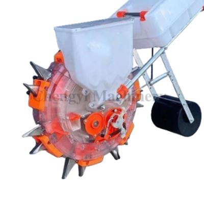 China Manual Seeder Machine With Fertilizing Walk Behind Planter For Easy Row Seeding for sale