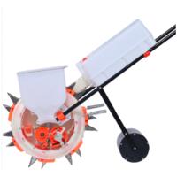 China Manual Seeder Machine with Fertilizing Hand Push Sower 14.5kg Dual Chamber for sale