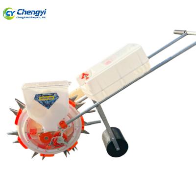 China ABS and Steel Manual Seeder Machine with Simultaneous Sowing and Fertilization and Adjustable Sowing Depth for Efficient Farming for sale