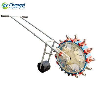 China Stainless Steel Hand Push Seeder with High-Speed Sowing and Precision Seed Dispenser for Efficient Garden Planting for sale