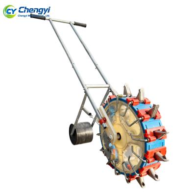 China Durable Polycarbonate Hand Push Seeder with Precision Metering and Ergonomic Handle for Manual Garden Sowing for sale