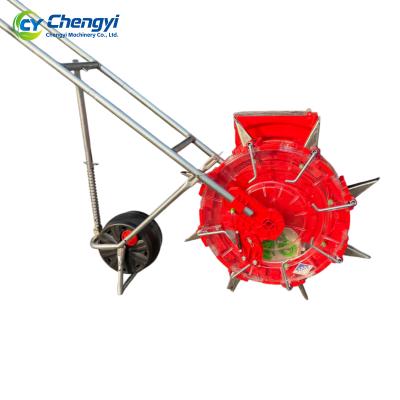 China Iron Manual Seeder Machine Push Planter Efficient Seed Sowing Equipment for Agriculture for sale