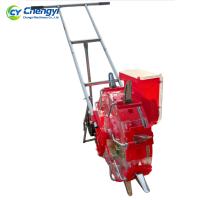 China Iron Manual Seeder Machine Hand Push Planter 7kg Seed Box Adjustable Spacing for sale