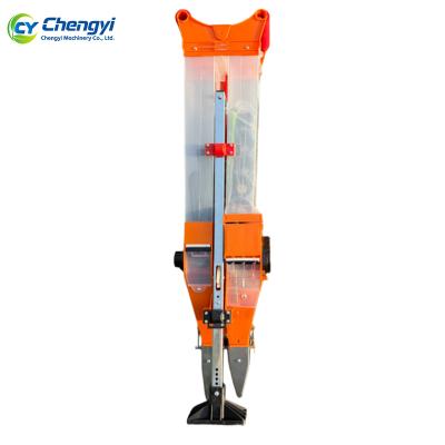China Manual Seeder Machine With Fertilizing Multi Functional Hand Push Seed Planter Tool for sale