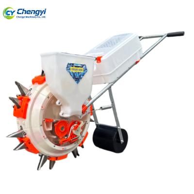 China Manual Seeder Machine With Fertilizing Walking Row Drill Portable Combined Sowing Equipment for sale