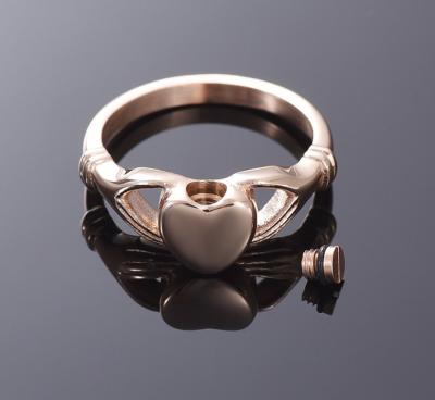 Cina Hand Embrace Heart Shape Cremation Memorial Ring Urne in acciaio inossidabile per ceneri umani in vendita